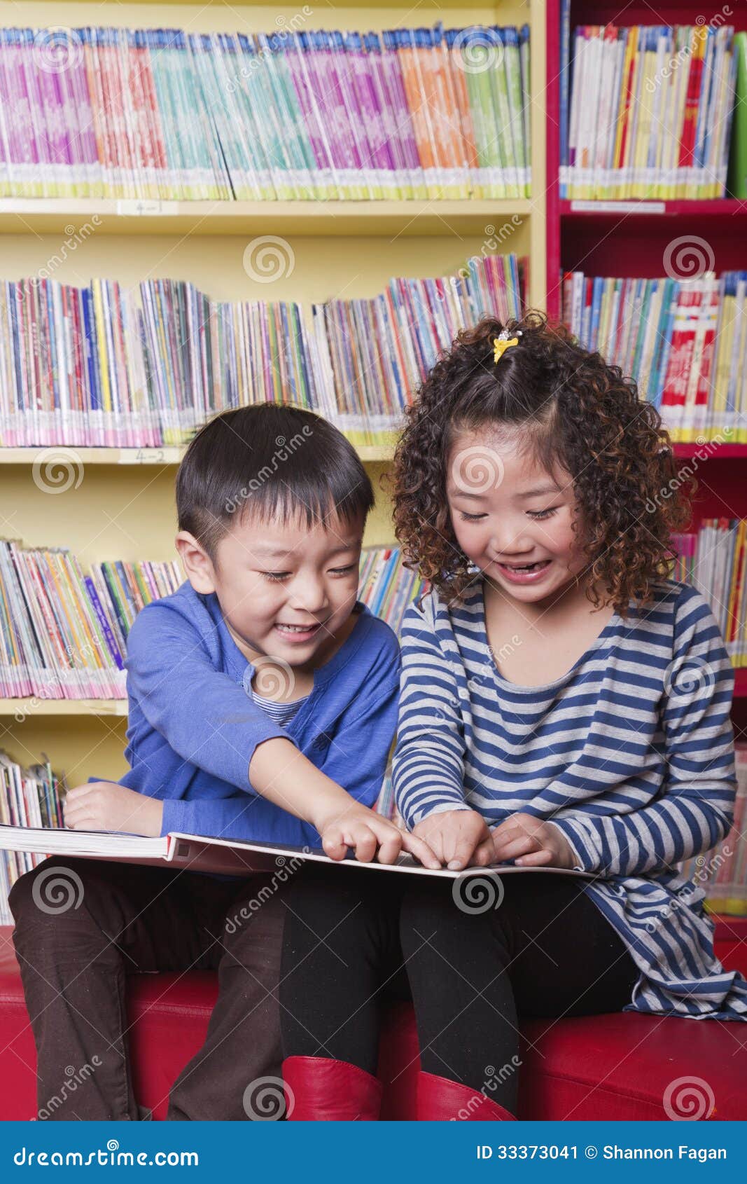 Boy and Girl Reading Together Stock Image - Image of book, holding ...