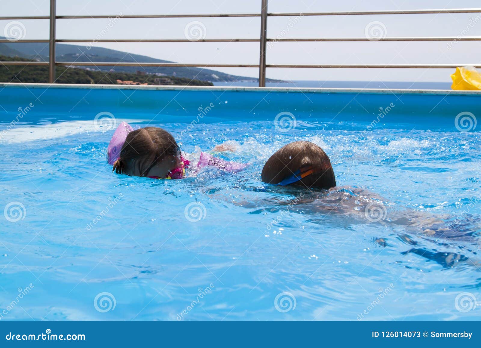 Boy and Girl Swimming in Pool in the Villa Stock Image - Image of ...
