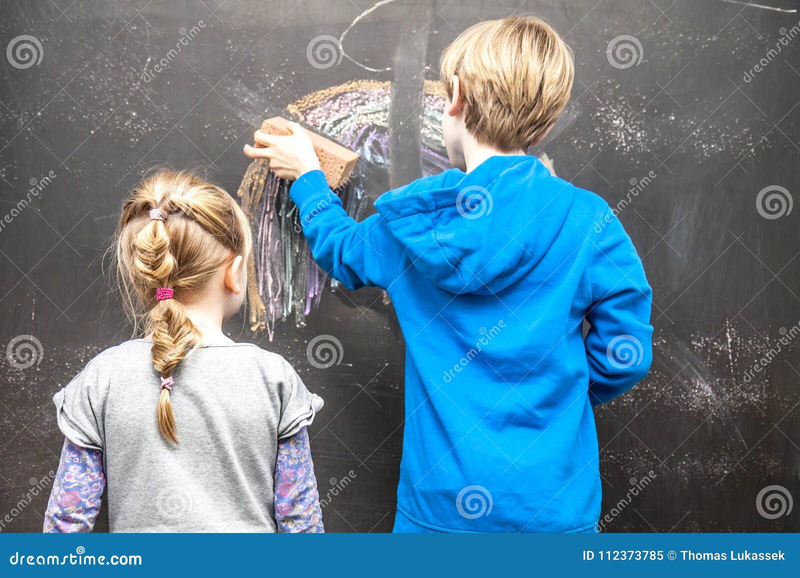Boy and Girl Using Chalkboard Stock Image - Image of blackboard, class ...