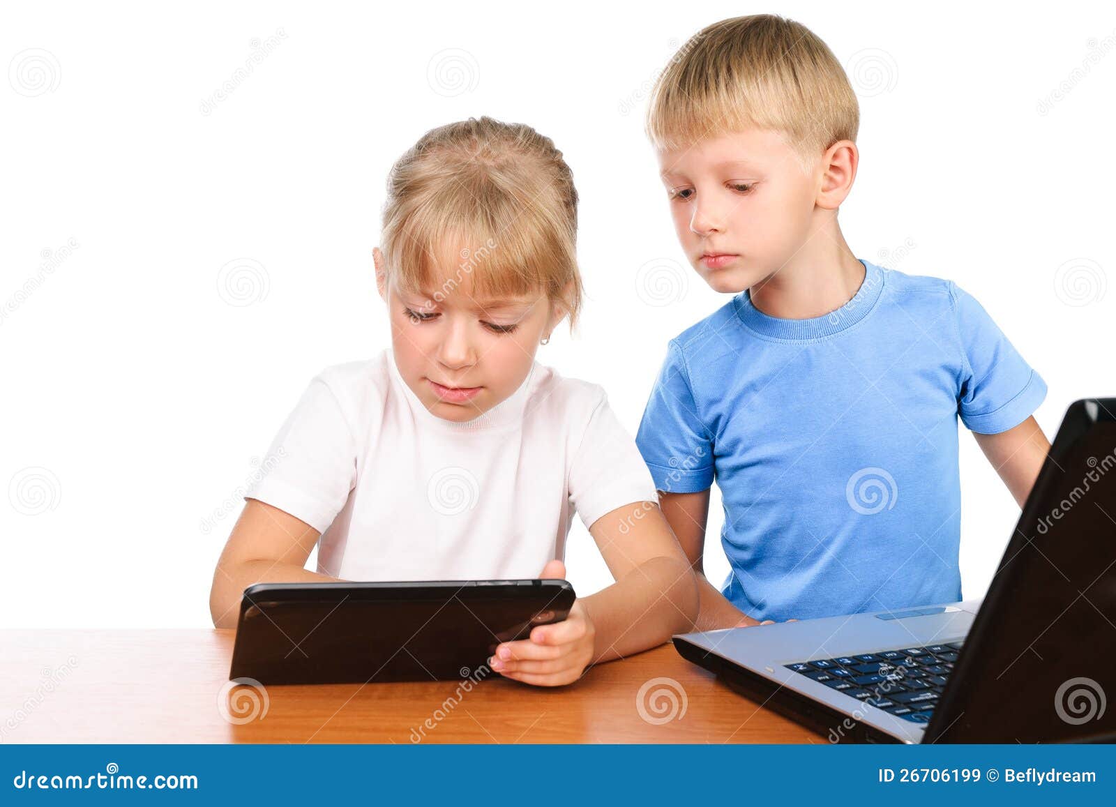 Boy and Girl Using Digital Pad and Laptop Stock Image - Image of ...
