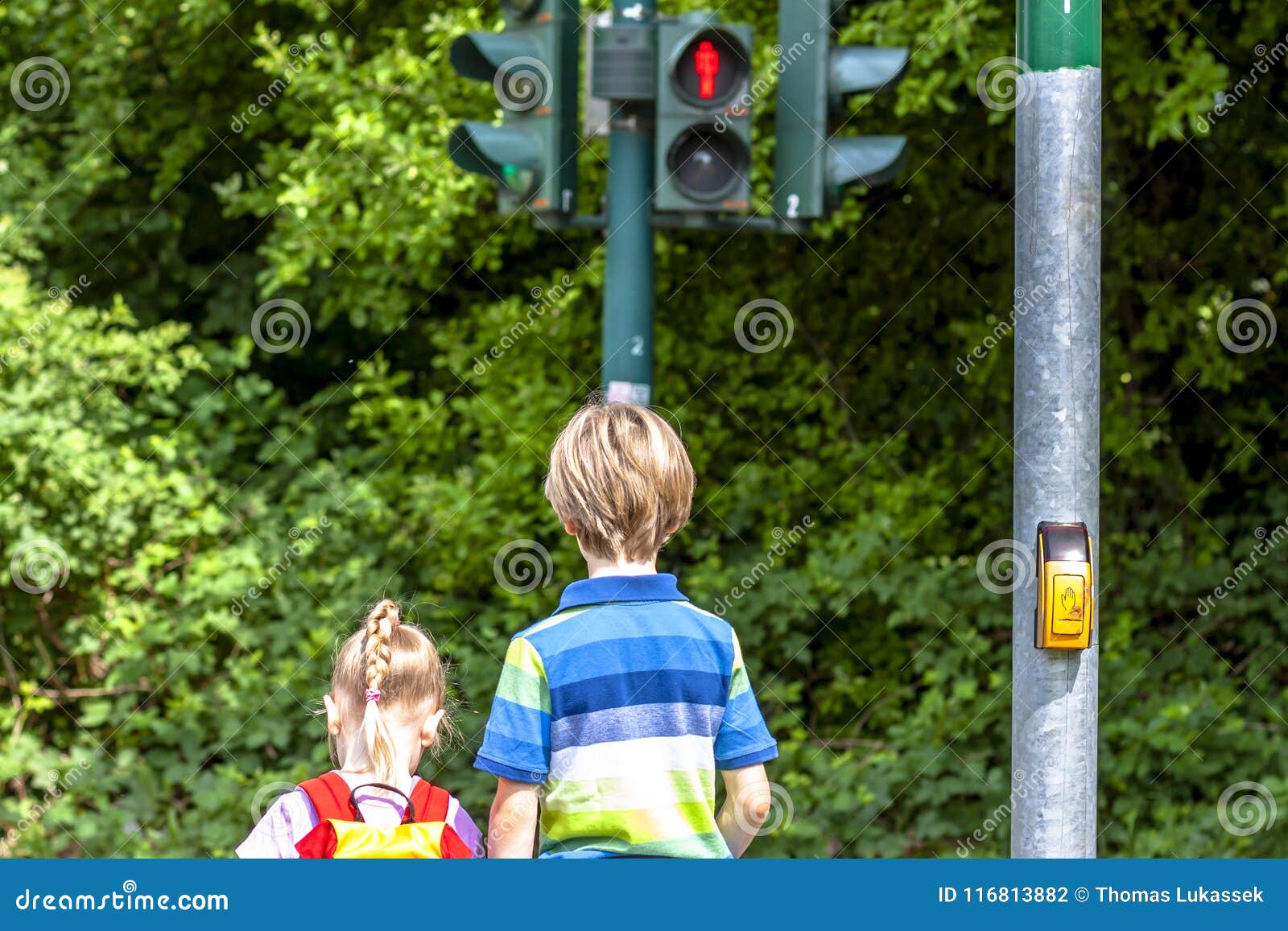 Boy and Girl Waiting at the Red Traffic Light Stock Photo - Image of ...