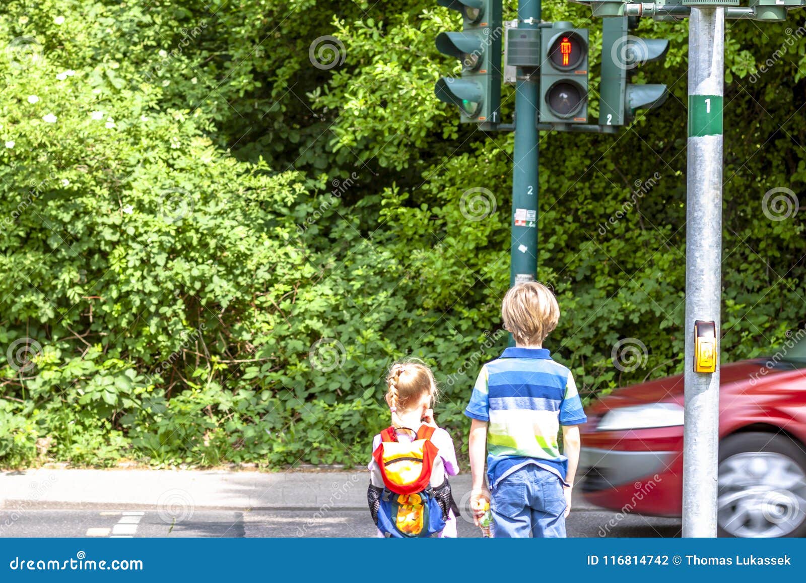Boy and Girl Waiting at the Red Traffic Light Stock Photo - Image of ...