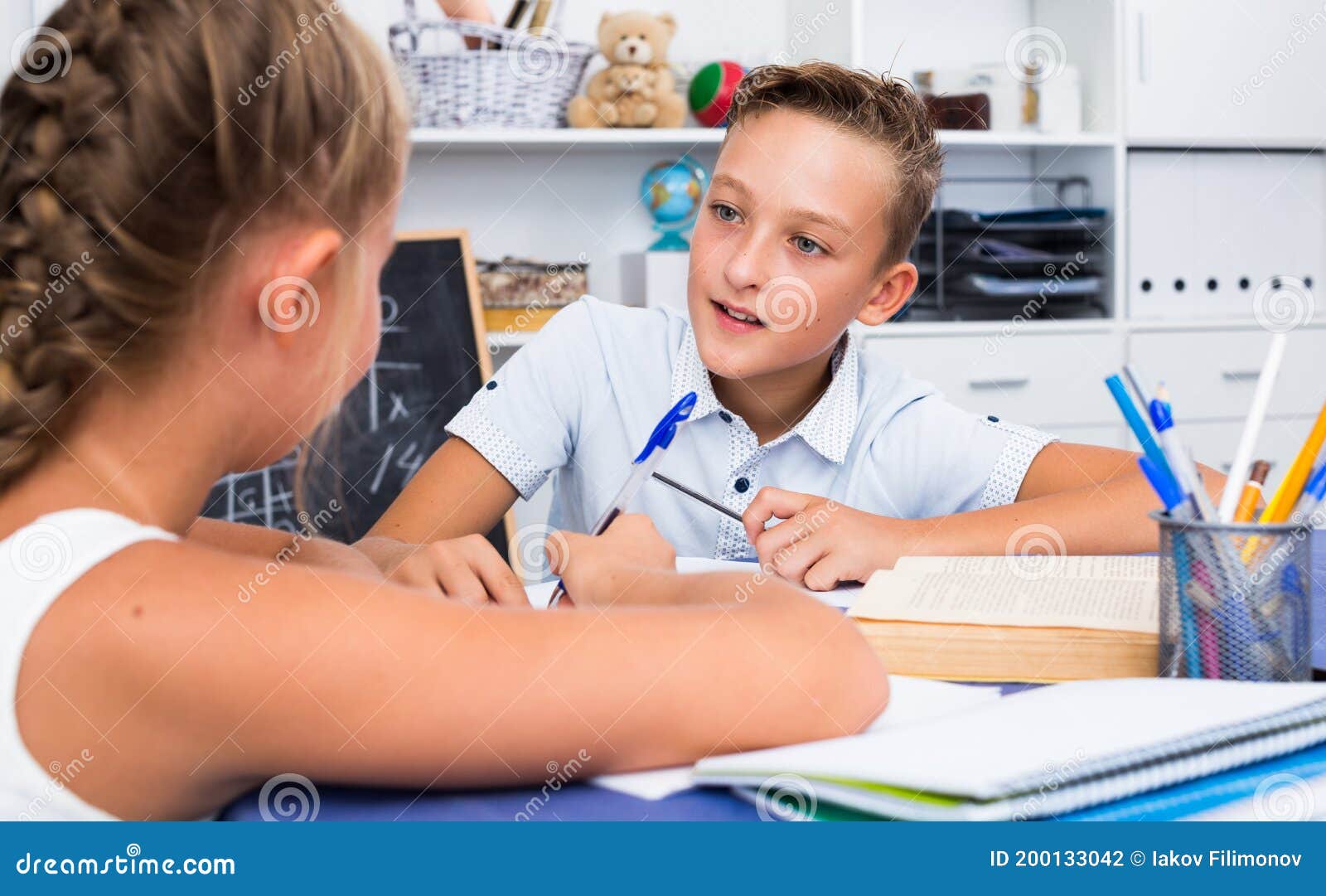 Boy with Girl are Writing in Notebook Their Homework Stock Photo ...
