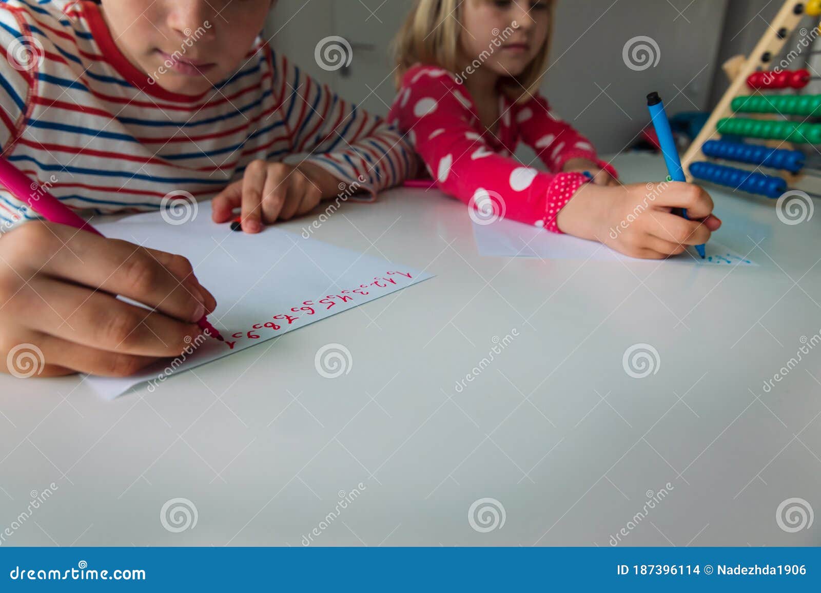 Boy and Girl Writing Numbers, Kids Doing Homework Stock Photo - Image ...