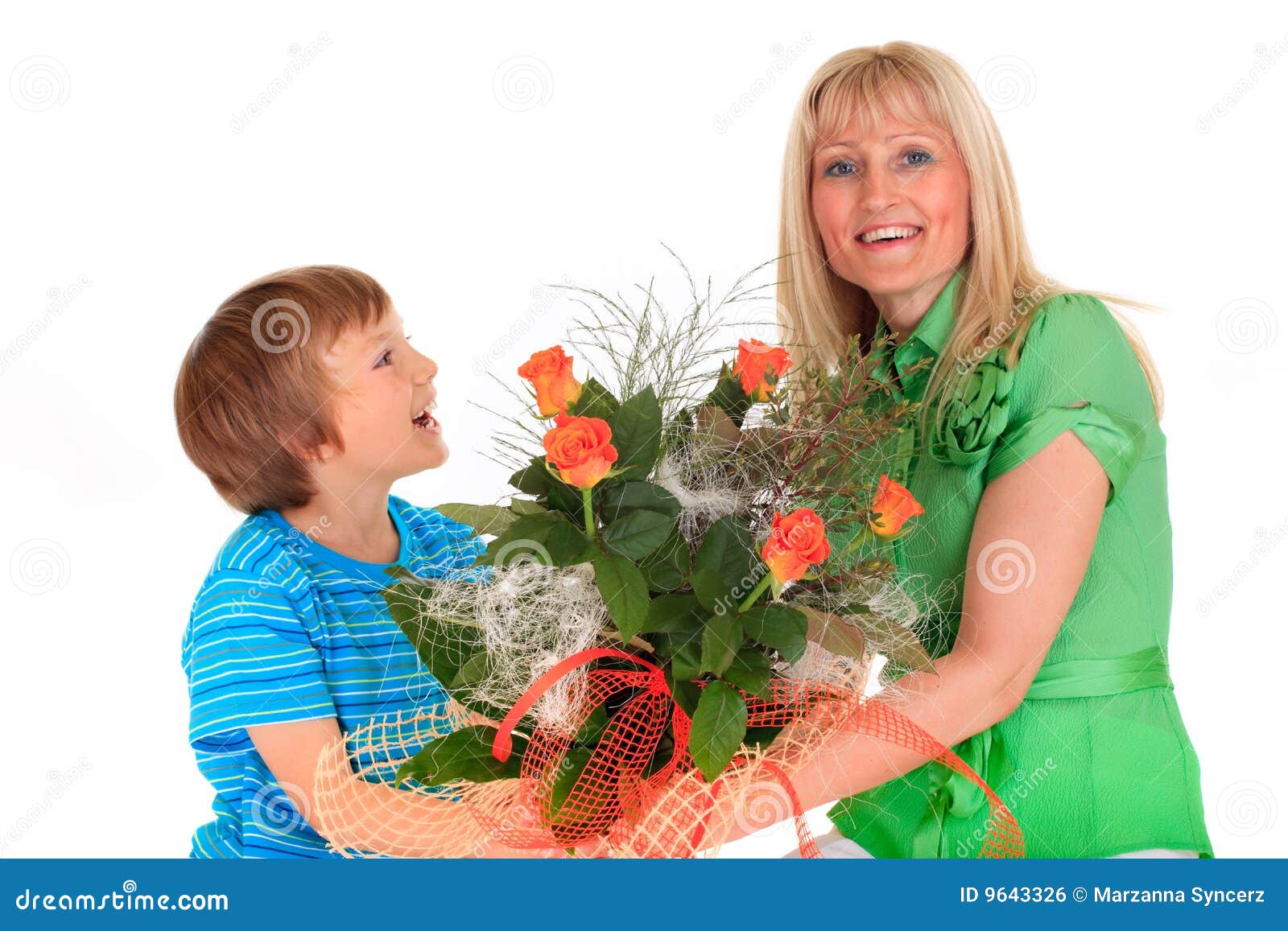 Boy giving flowers to mom stock photo. Image of attractive - 9643326