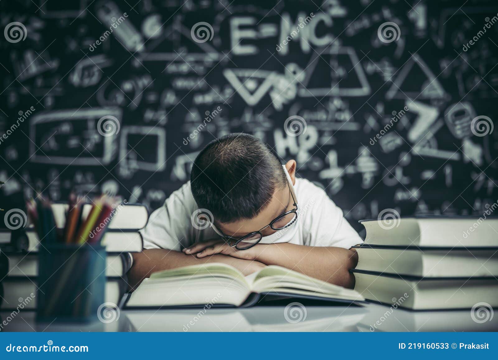 A Boy with Glasses Studying and Drowsy Stock Image - Image of nerd ...