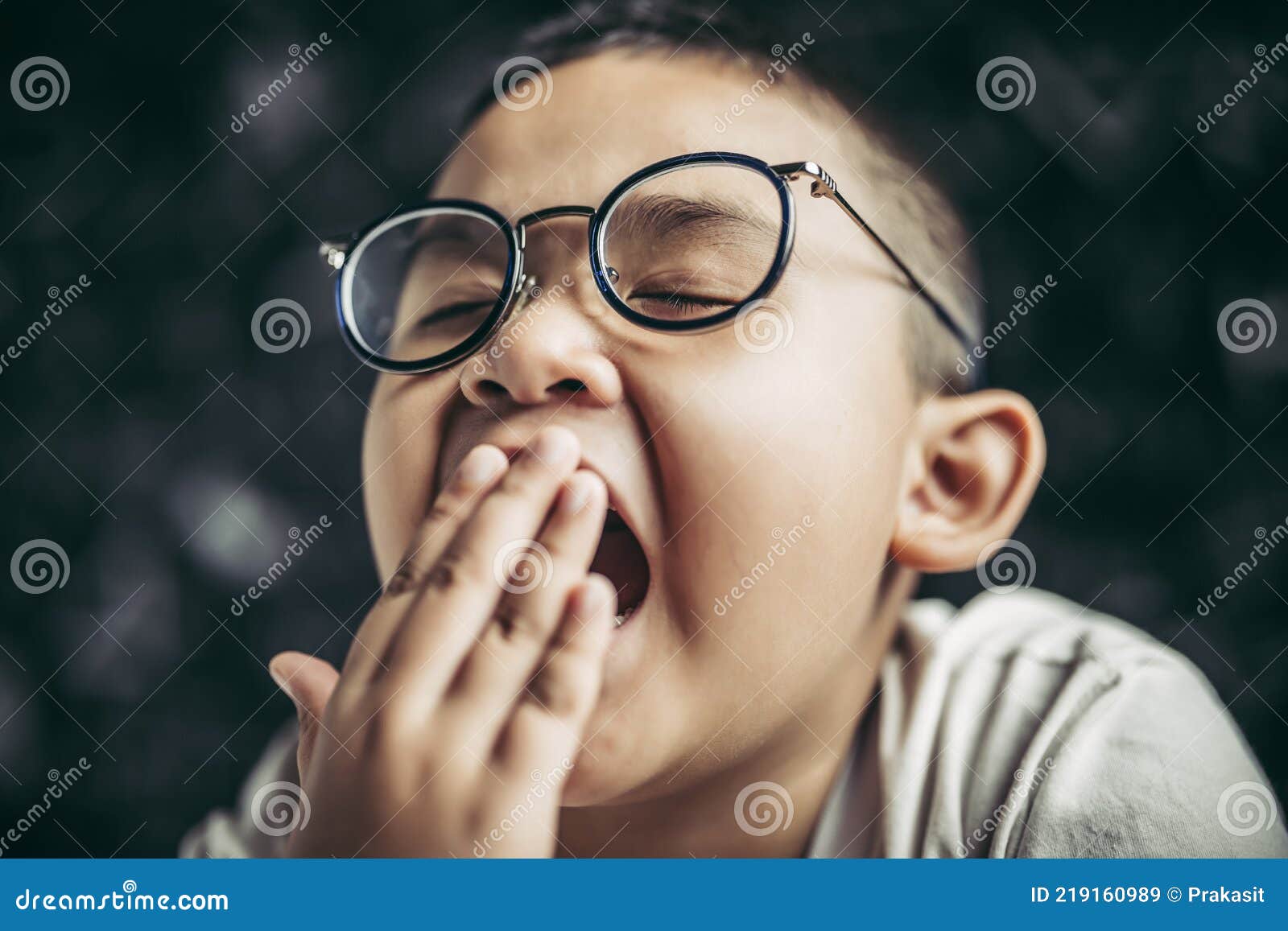 A Boy with Glasses Studying and Drowsy Stock Image - Image of school ...