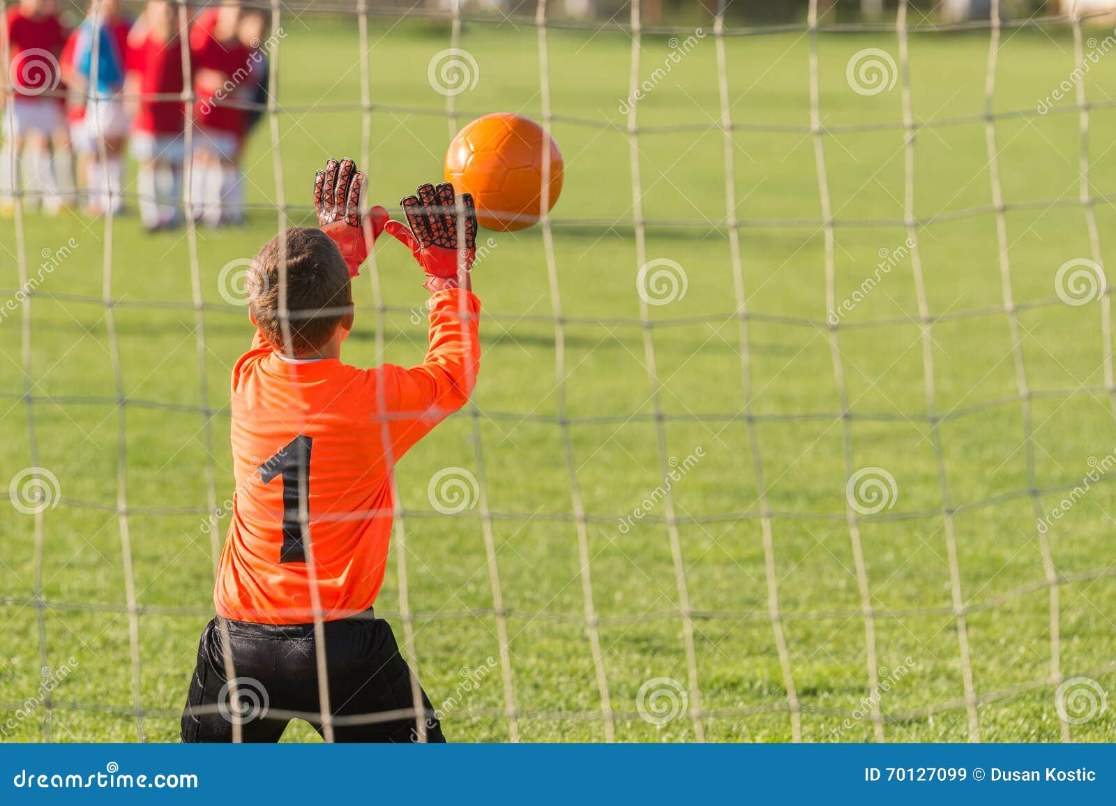 Boy goalkeeper defends stock image. Image of green, catch - 70127099