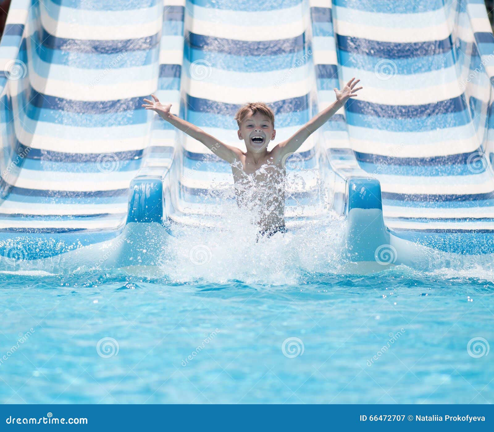 Boy Going Down Water Slide in Pool Stock Image - Image of aquatic ...