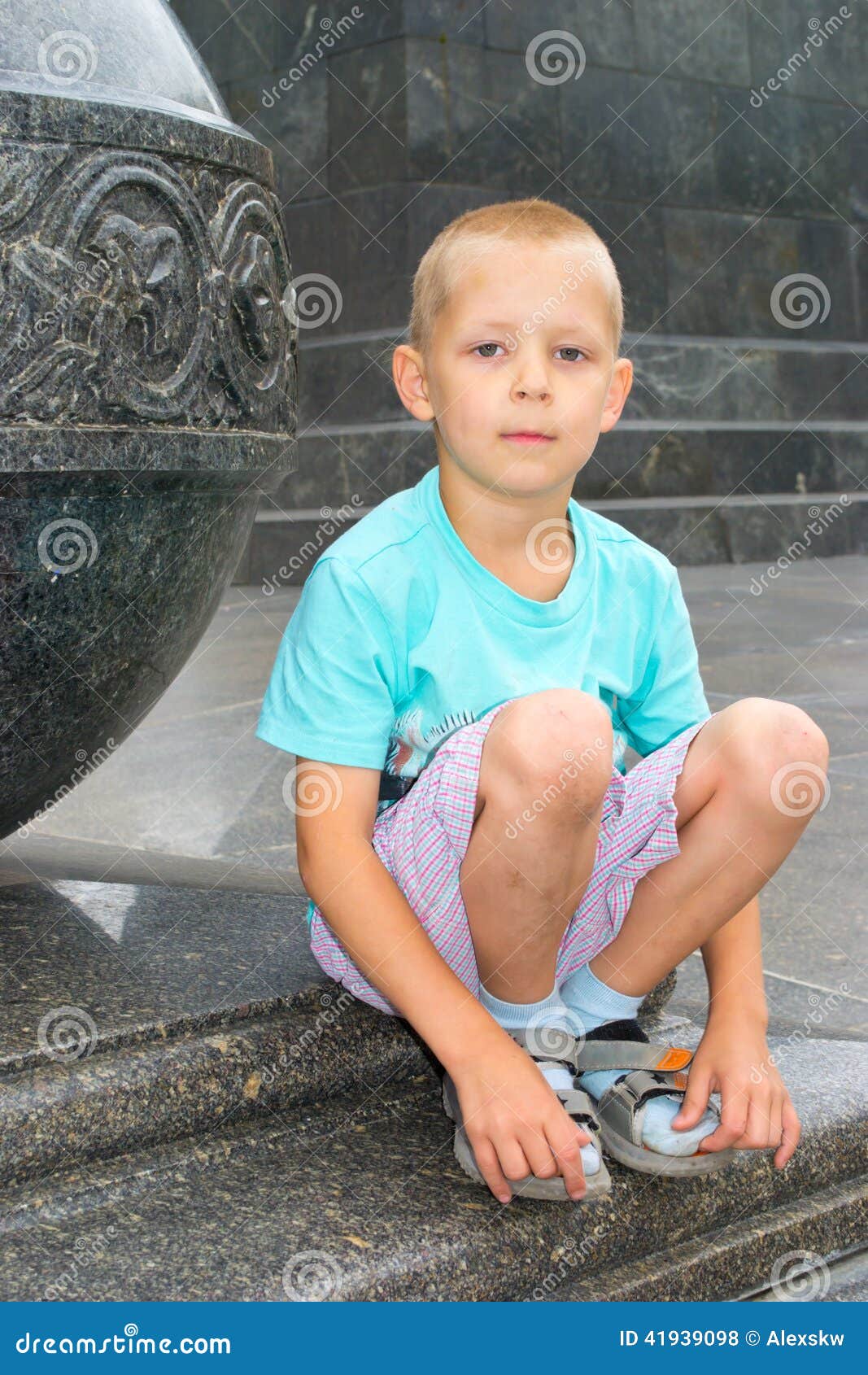 Boy on a granite bowl stock photo. Image of child, city - 41939098