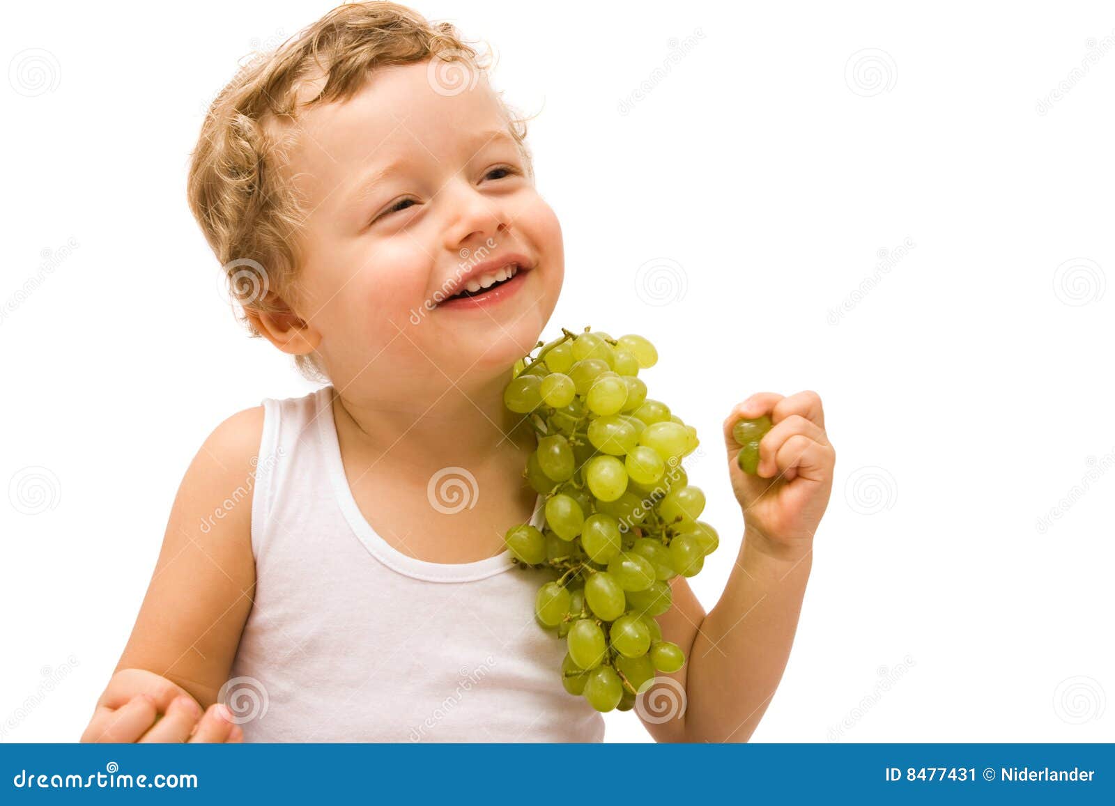 Boy with grapes stock image. Image of hands, look, face - 8477431