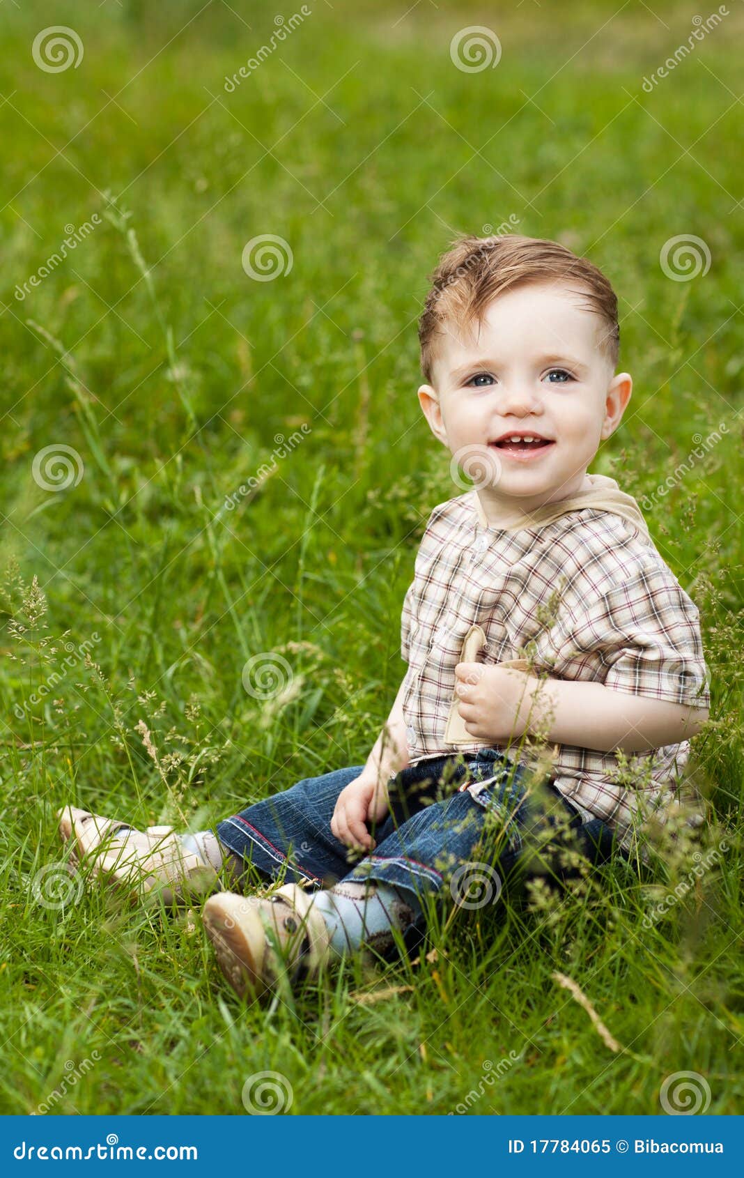 Boy on grass stock image. Image of jeans, male, beautiful - 17784065