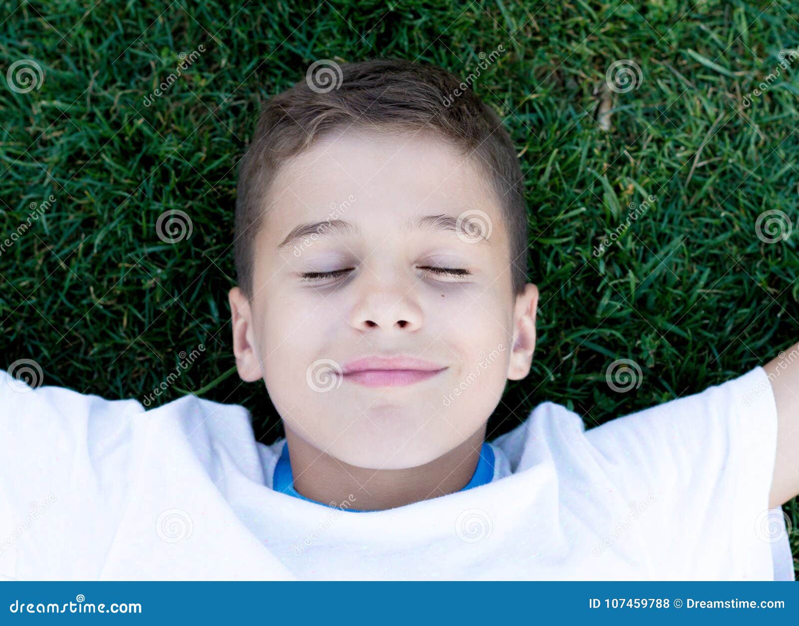 Boy on green grass stock photo. Image of japan, white - 107459788