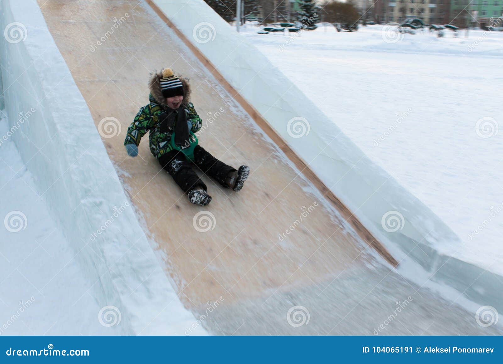 The Boy Slides on the Ice Slide Stock Image - Image of healthy, happy ...