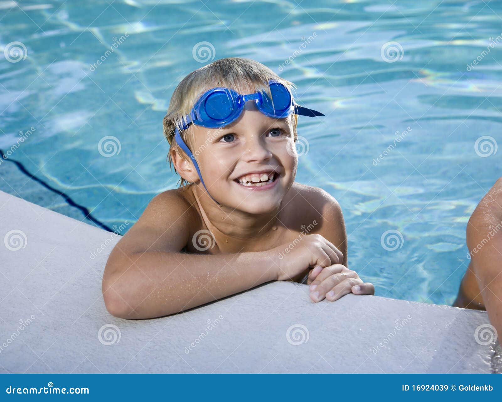 Boy Grinning, Hanging on To Side of Swimming Pool Stock Image - Image ...