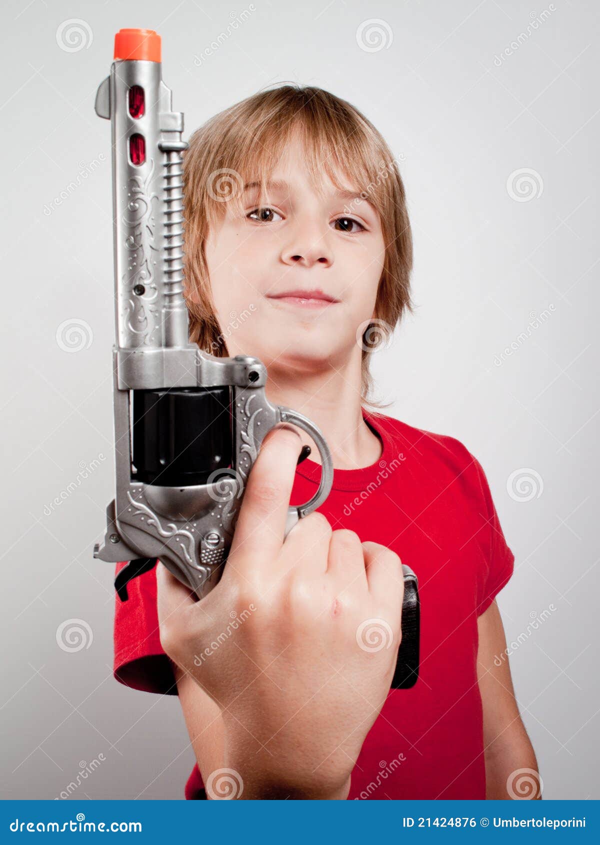 Boy with gun toy stock photo. Image of handgun, point - 21424876