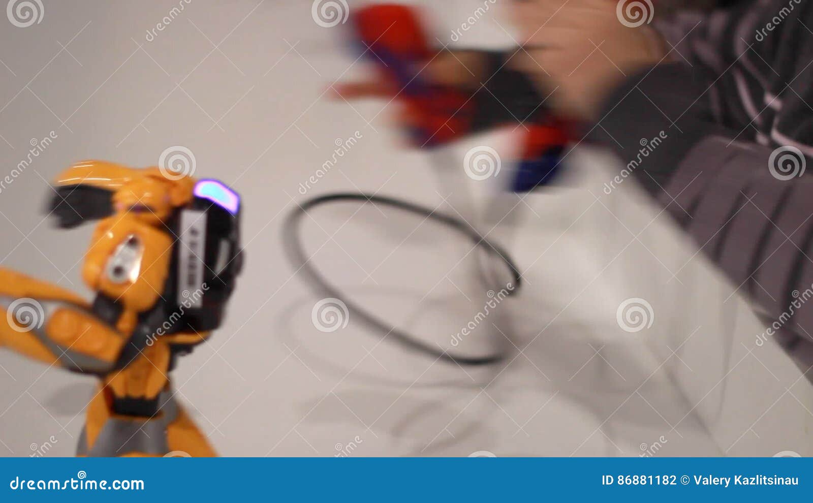 Boy Hand Remote Controlling Robot. Remote Controller in Kid Hands Stock ...