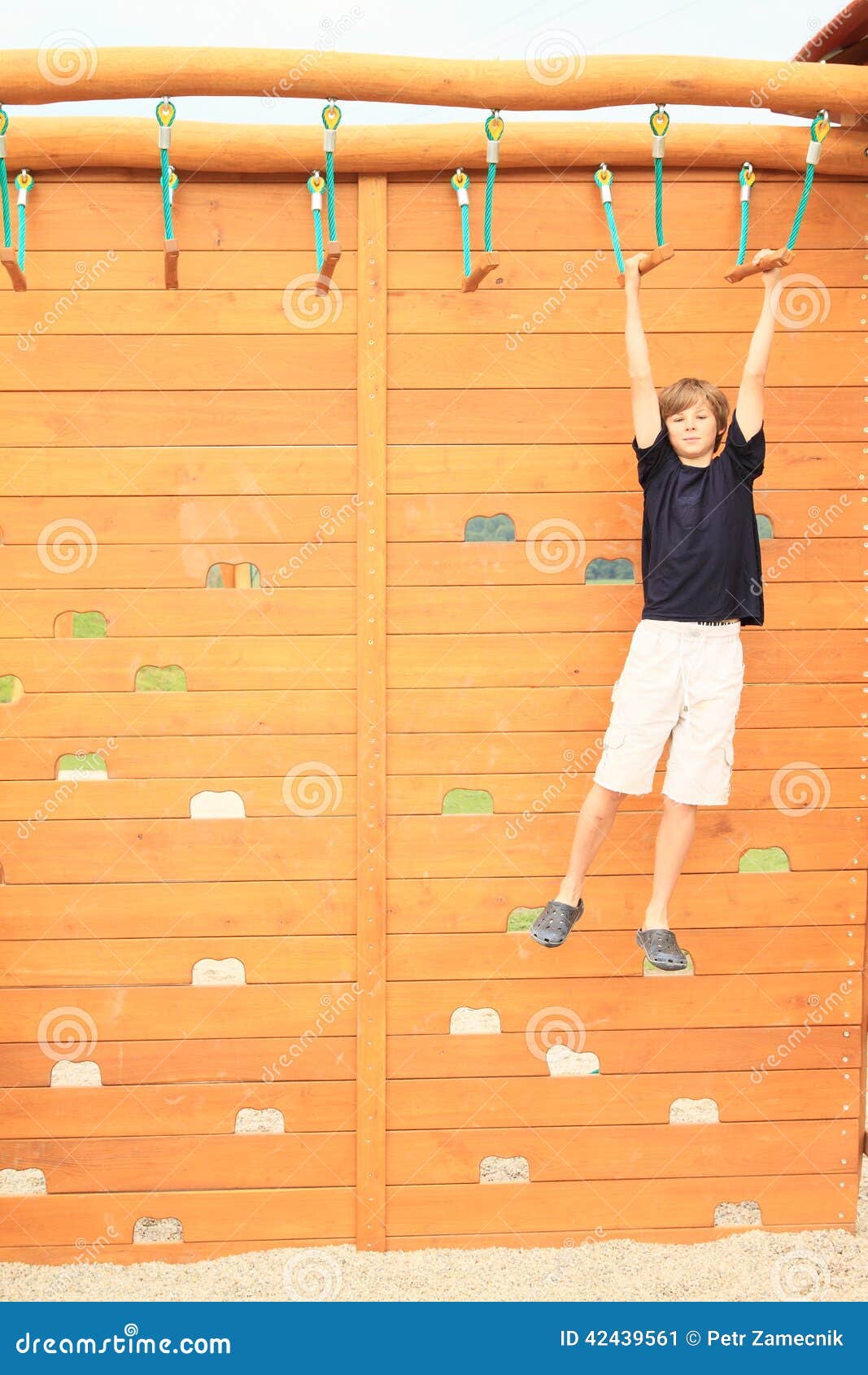 Boy Hanging on Obstacle Course Stock Image - Image of enjoying, crocks ...