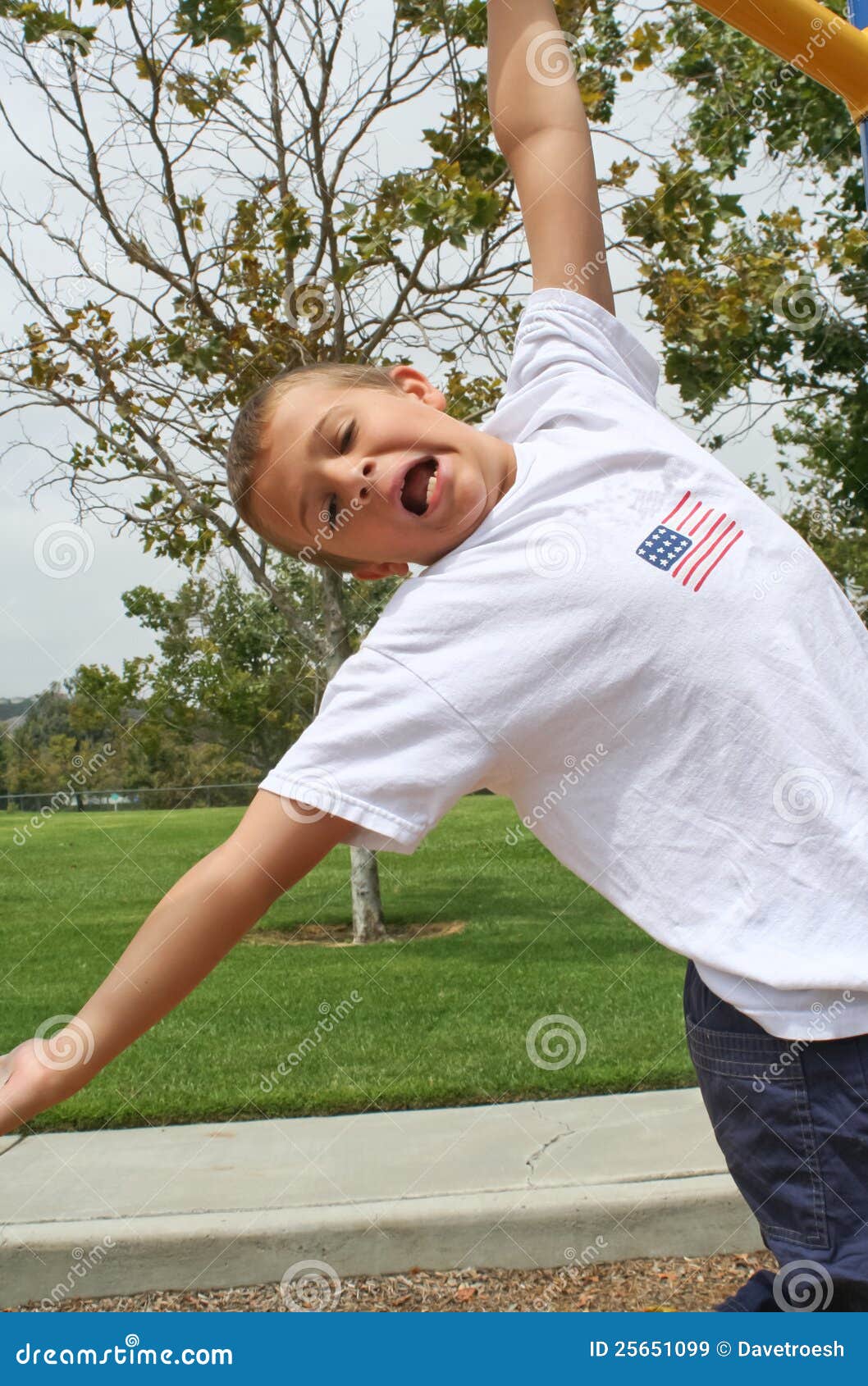 Boy hanging from one hand stock image. Image of bars - 25651099