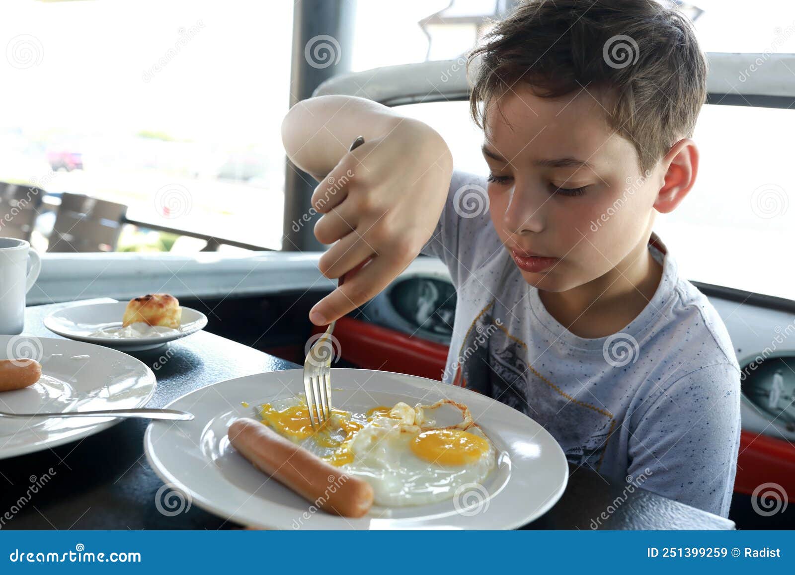 Boy Has Breakfast in Restaurant Stock Image - Image of person ...