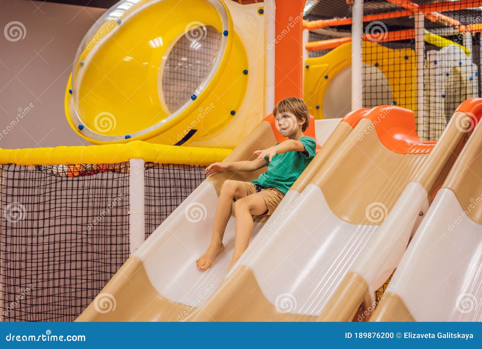 The Boy Has Fun in an Indoor Playground Stock Photo - Image of park ...