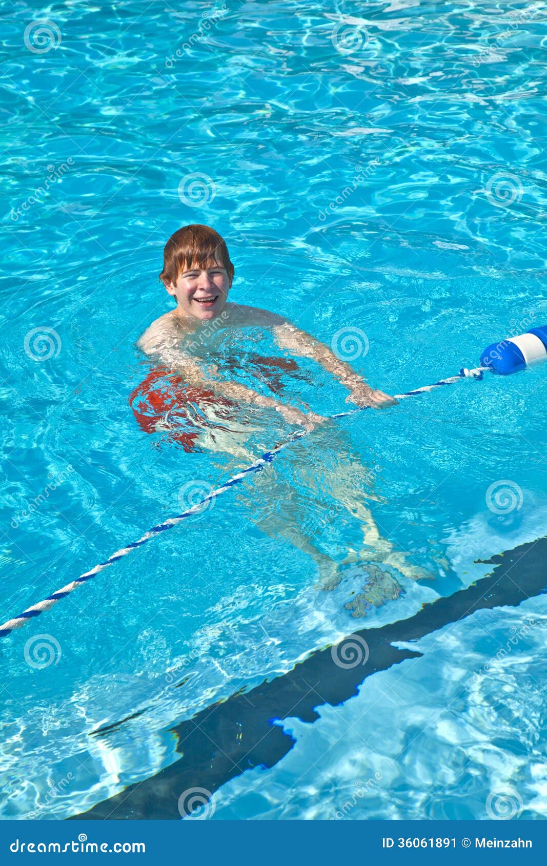 Boy has fun in the pool stock image. Image of attractive - 36061891