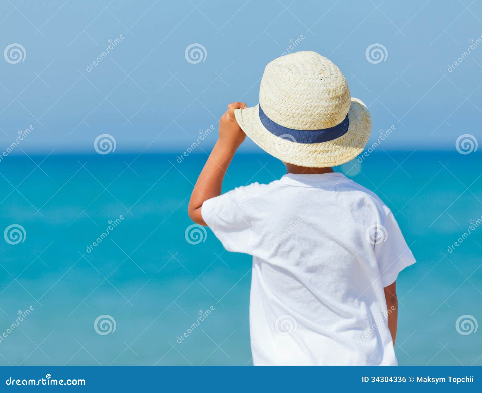 Boy with hat on the beach stock photo. Image of lifestyle - 34304336