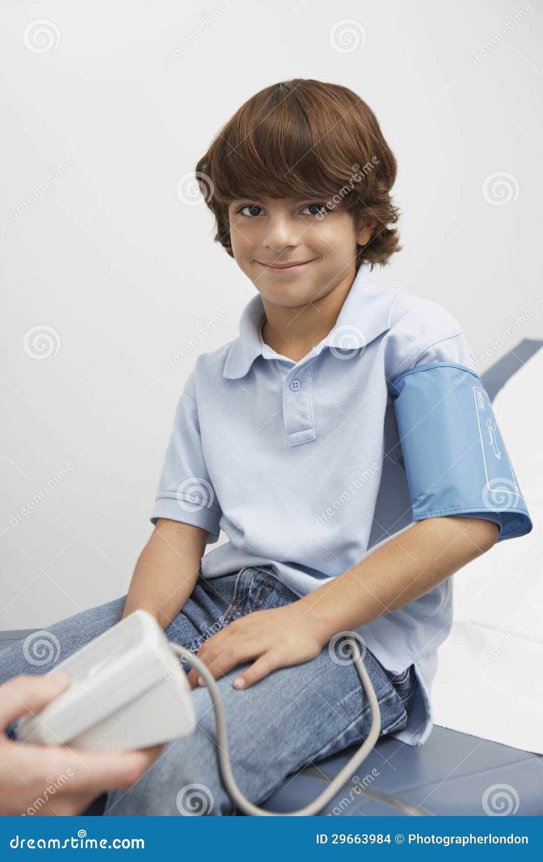 Boy Having Blood Pressure Taken Stock Photo - Image of checking ...