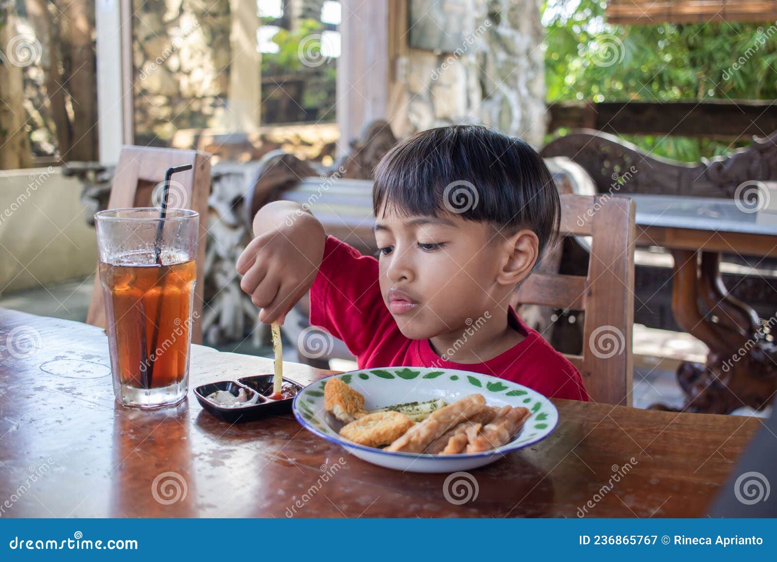A Boy is Having Breakfast Snacks Stock Image - Image of laughing, dirty ...