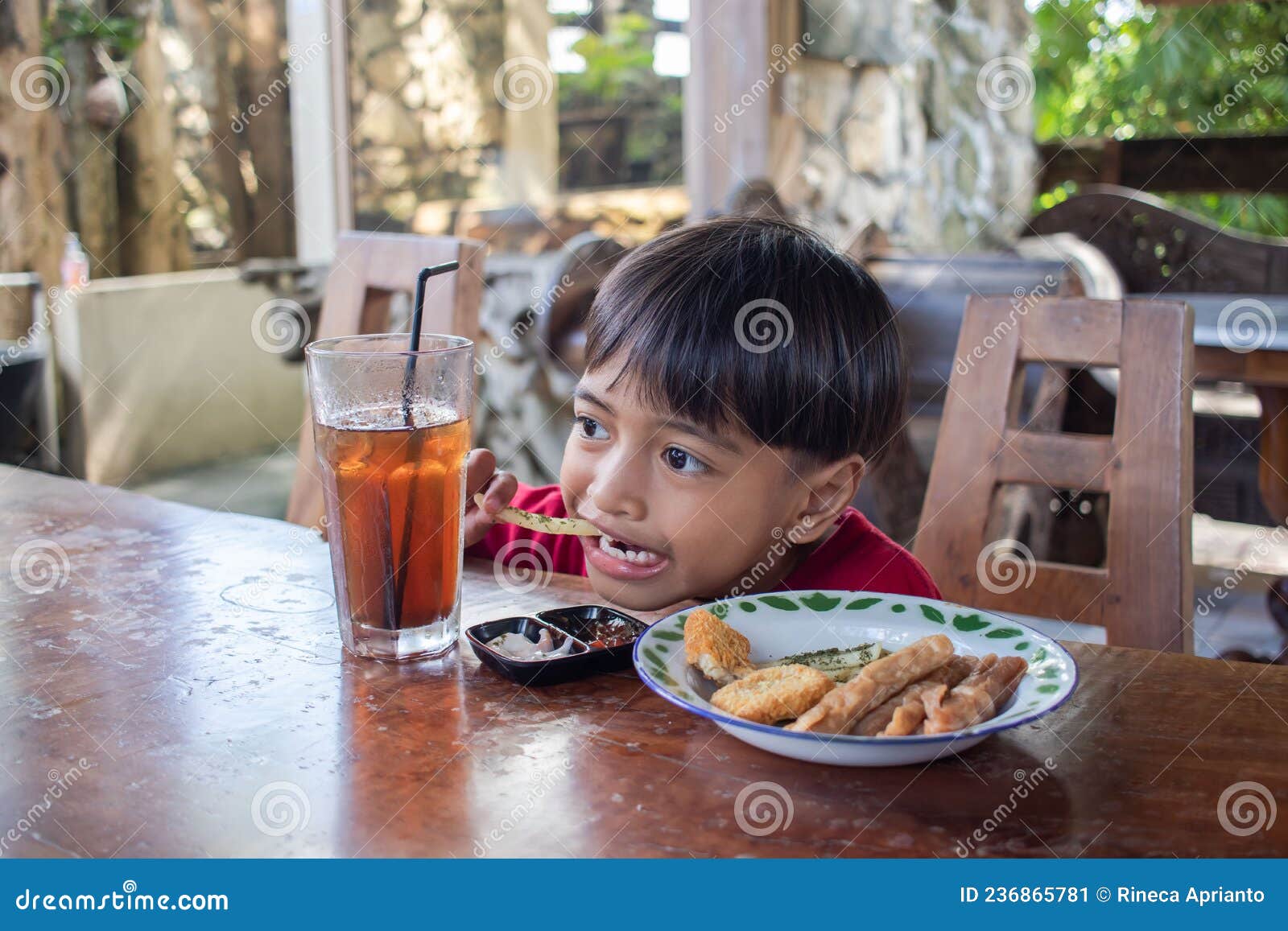 A Boy is Having Breakfast Snacks Stock Image - Image of laughing, bread ...