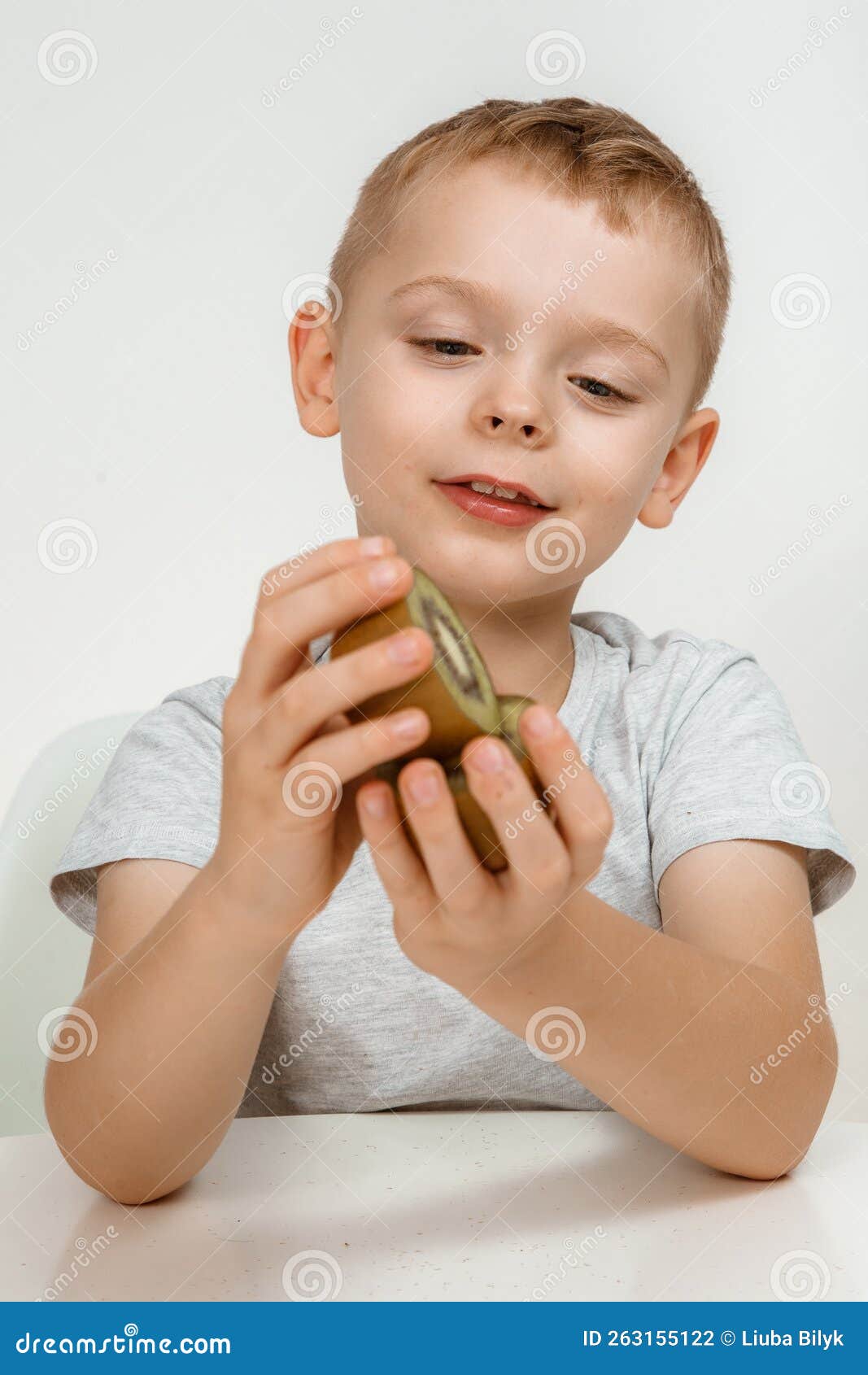 A Boy Having Fun on Studio Grey Background. Stock Photo - Image of ...