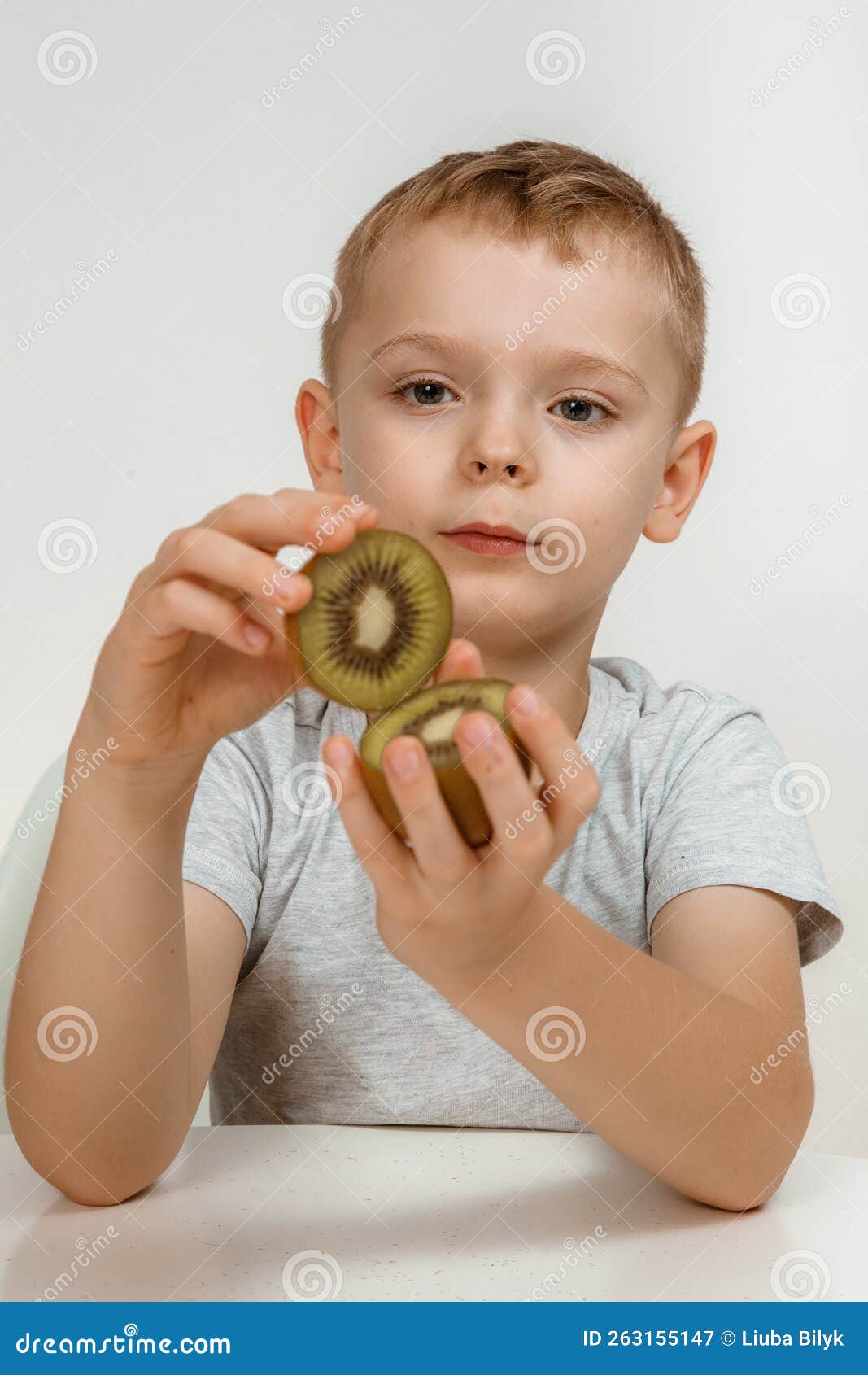 A Boy Having Fun on Studio Grey Background. Stock Image - Image of ...