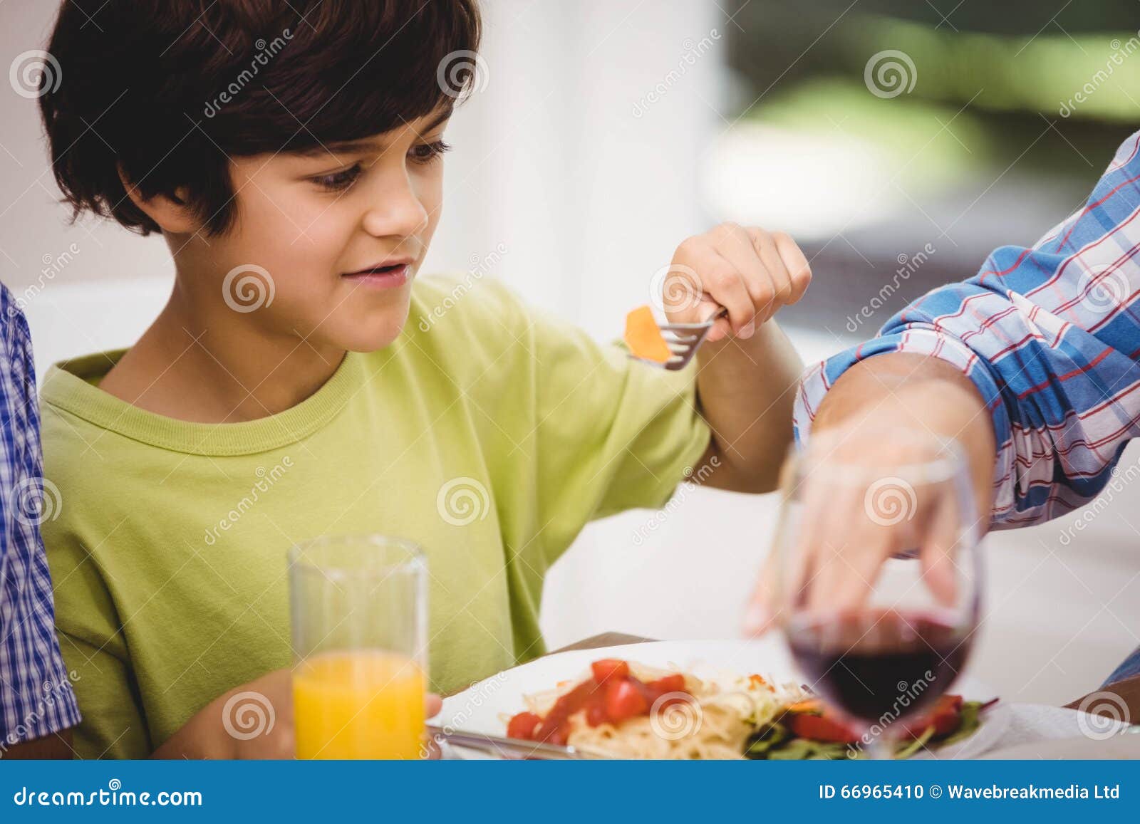 Boy Having a Meal at Dining Table Stock Photo - Image of house ...