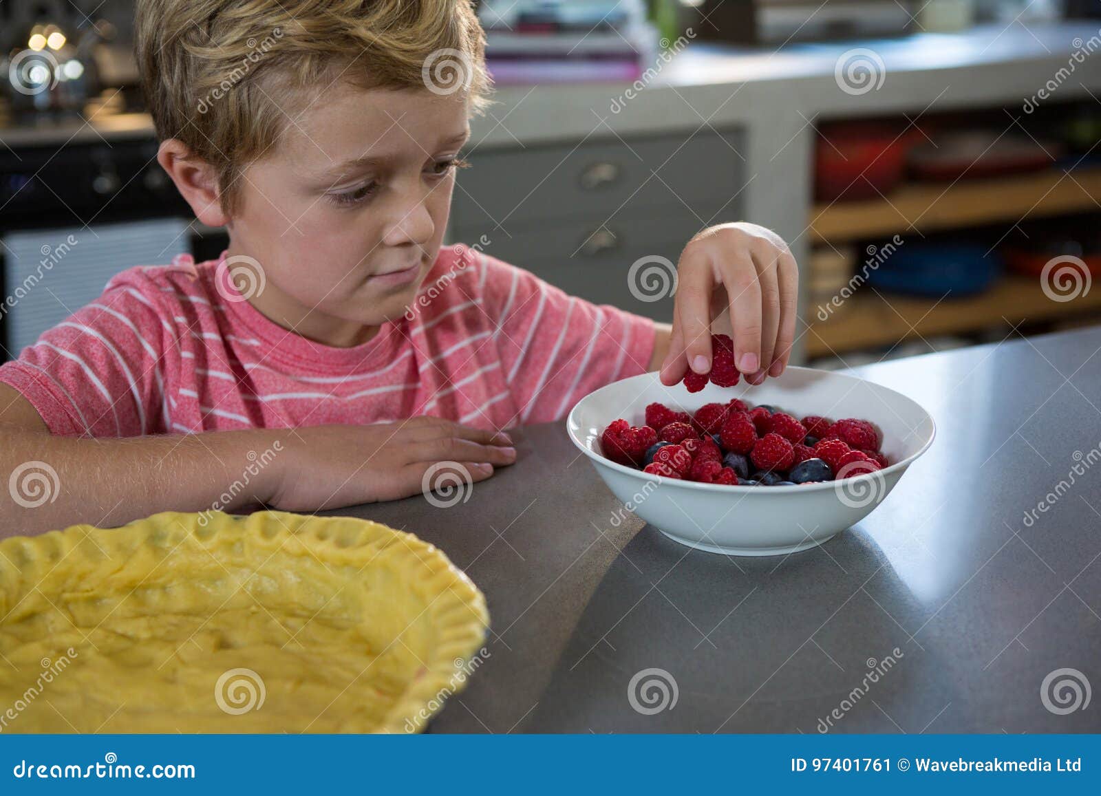 Boy Having Raspberries in Kitchen Stock Image - Image of food ...