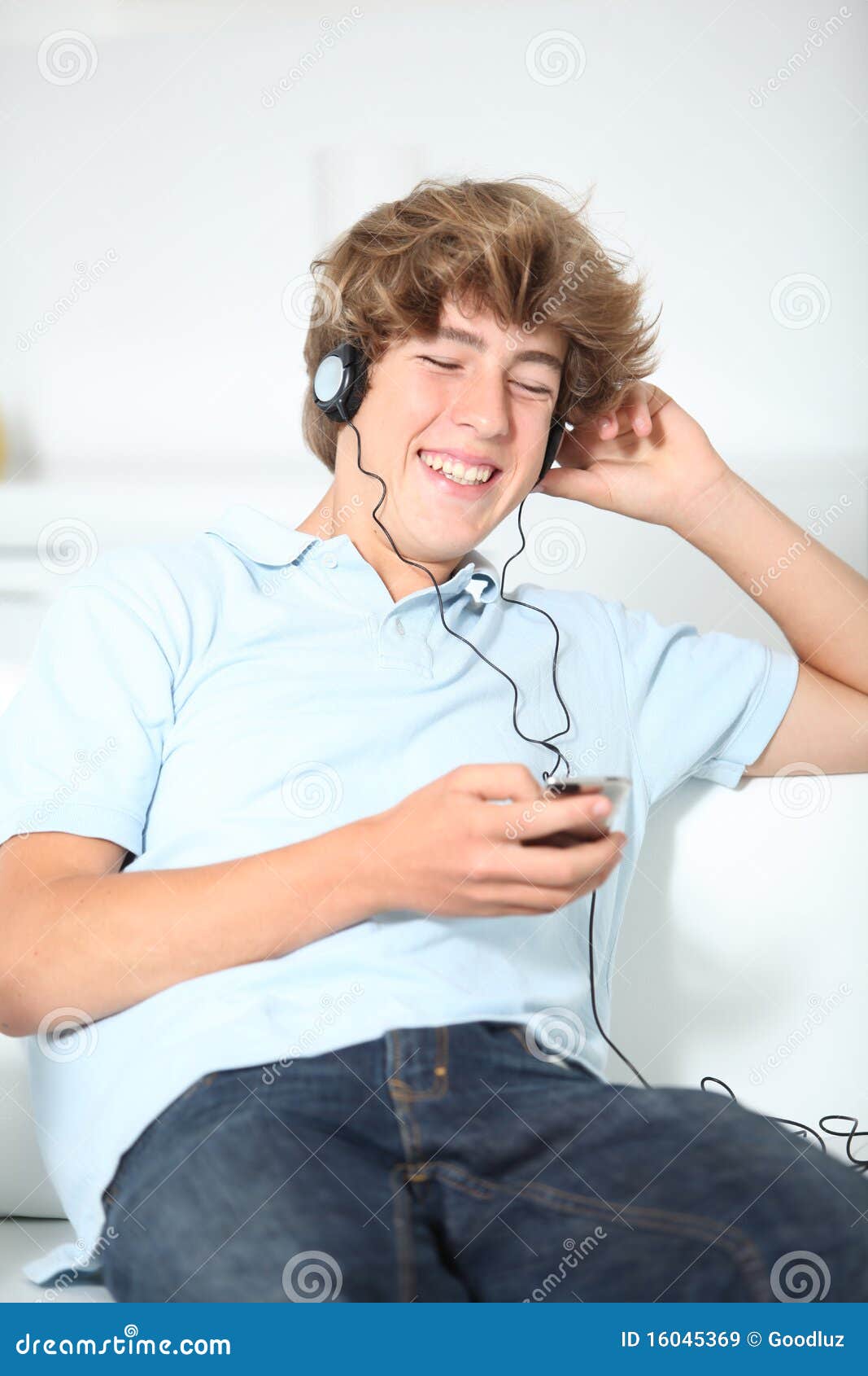 Boy with headphones stock image. Image of sofa, player - 16045369
