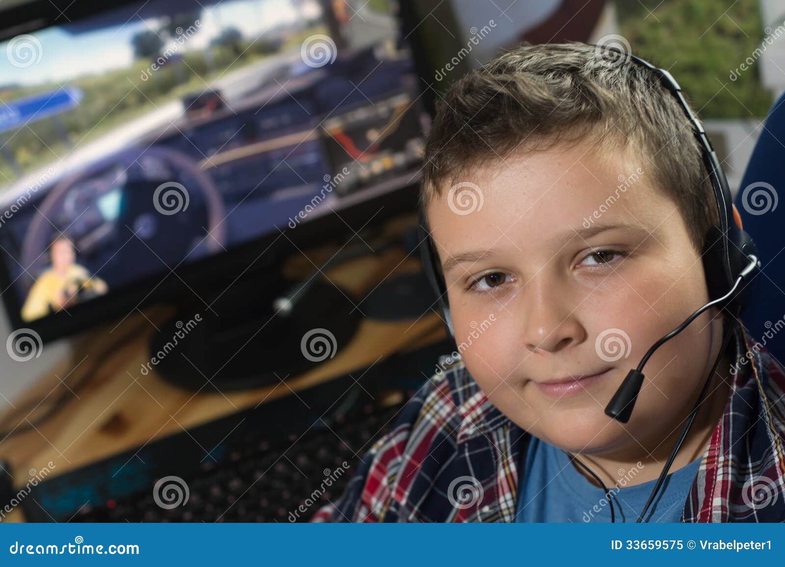 Boy with Headphones is Playing a Computer Game Stock Image - Image of ...