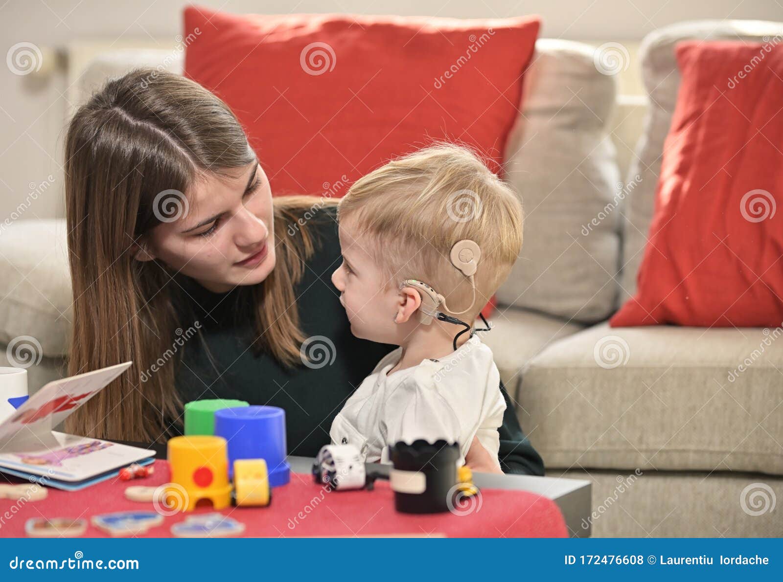 A Boy with a Hearing Aids and Cochlear Implants Stock Photo - Image of ...