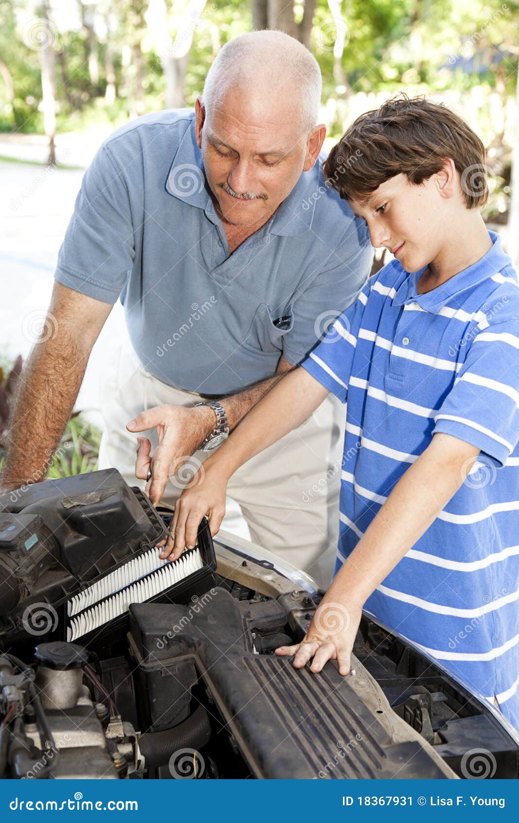 Boy Helps Dad stock image. Image of person, people, auto - 18367931
