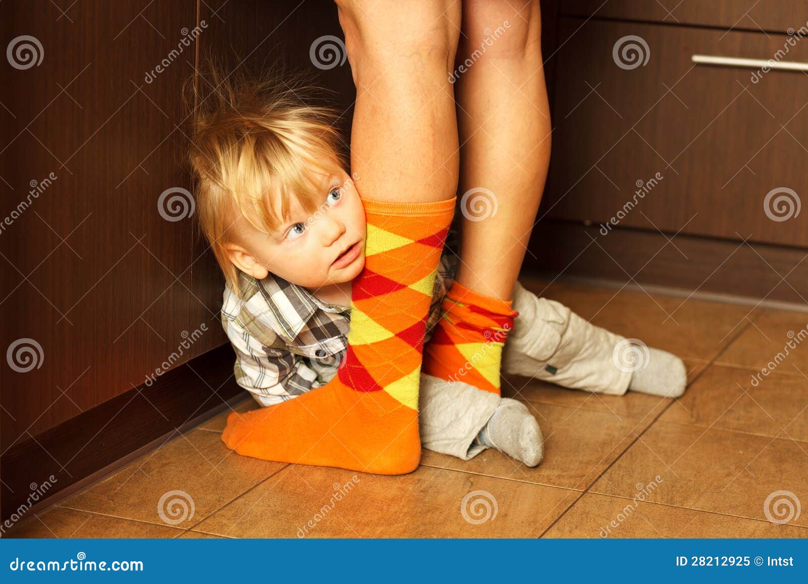 Child Hiding Behind Mother