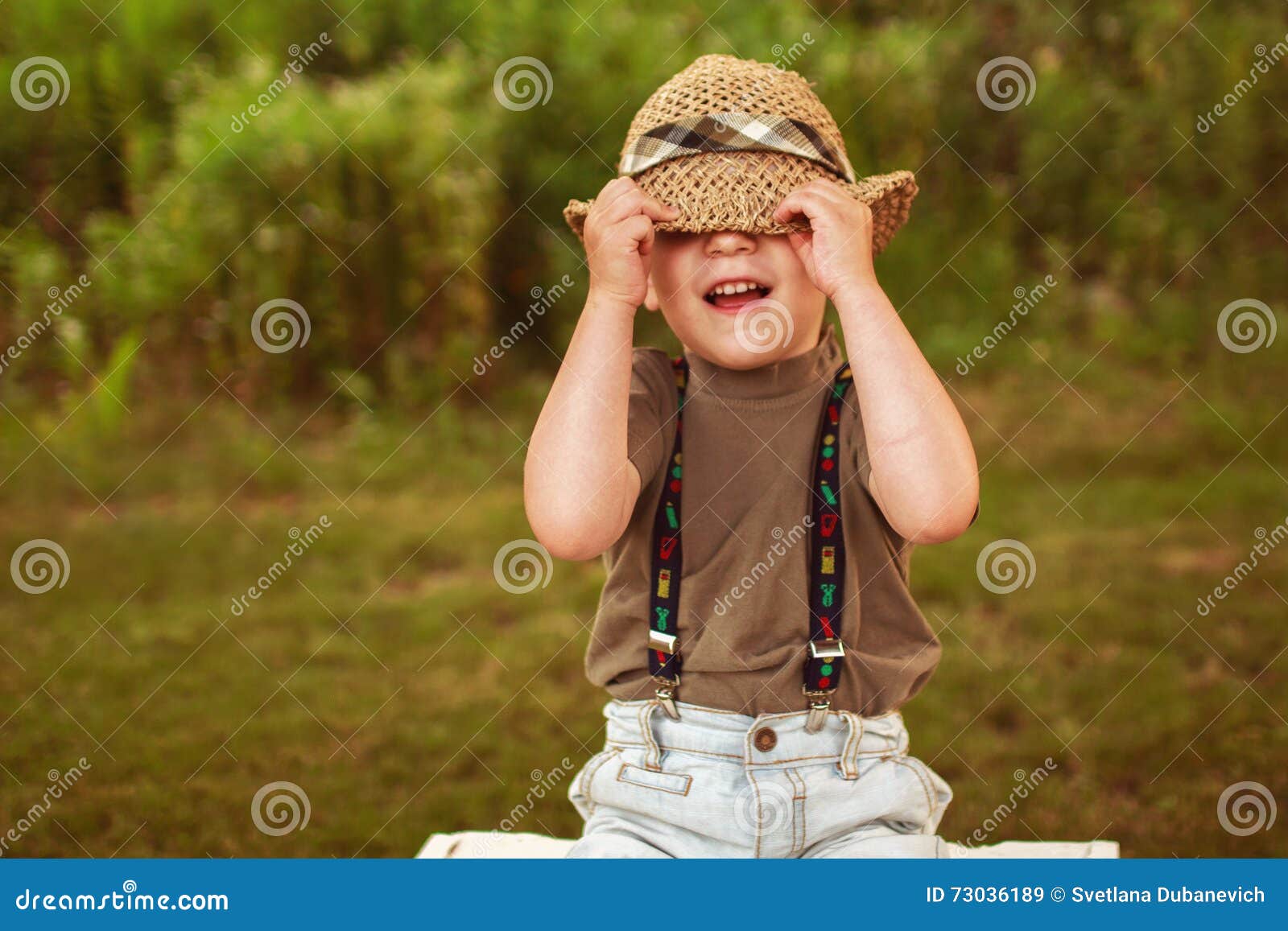 Boy Hiding His Face with His Hat Stock Image - Image of face, childhood ...