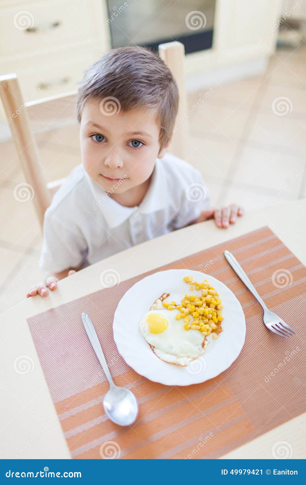 Boy and his breakfast stock image. Image of interior - 49979421