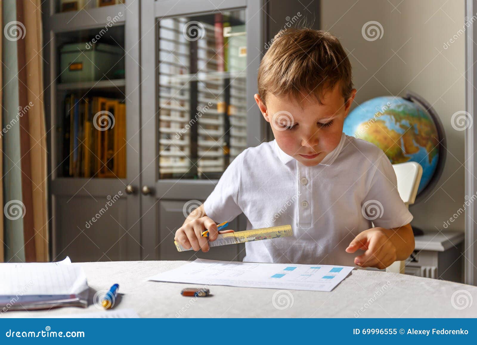Boy at his homework stock image. Image of full, education - 69996555