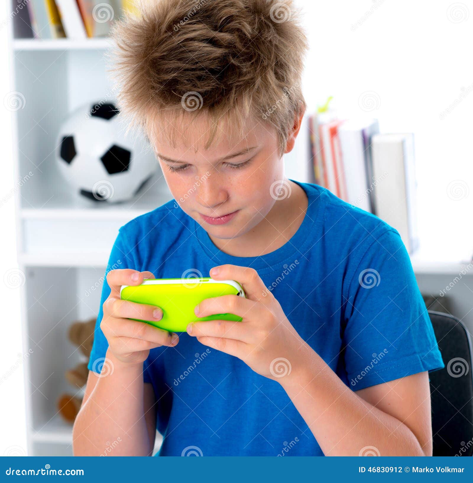 Boy with his smartphone stock photo. Image of desk, book - 46830912