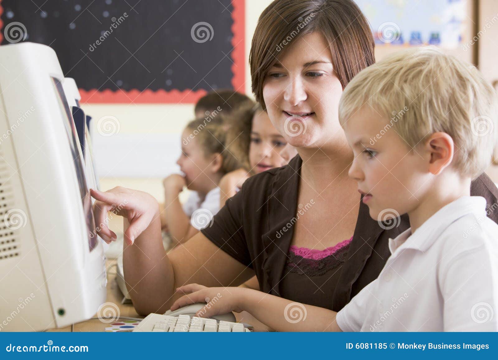 A Boy and His Teacher Working on a Computer. Stock Image - Image of ...