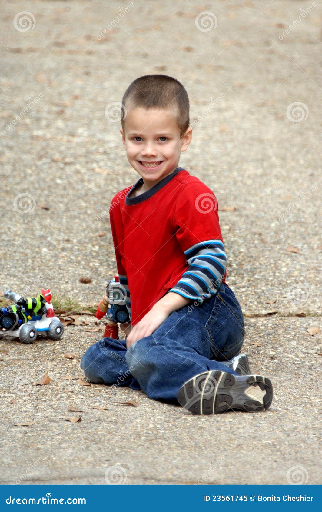 Boy and his toys stock image. Image of casual, handsome - 23561745