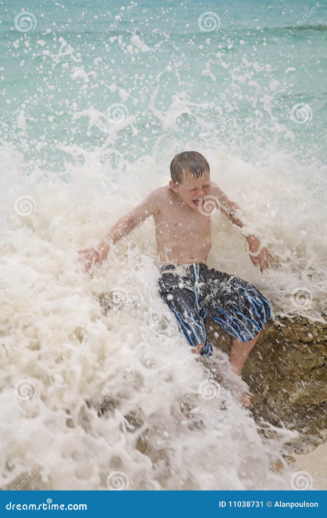 Boy hit by wave stock image. Image of ocean, surprised - 11038731