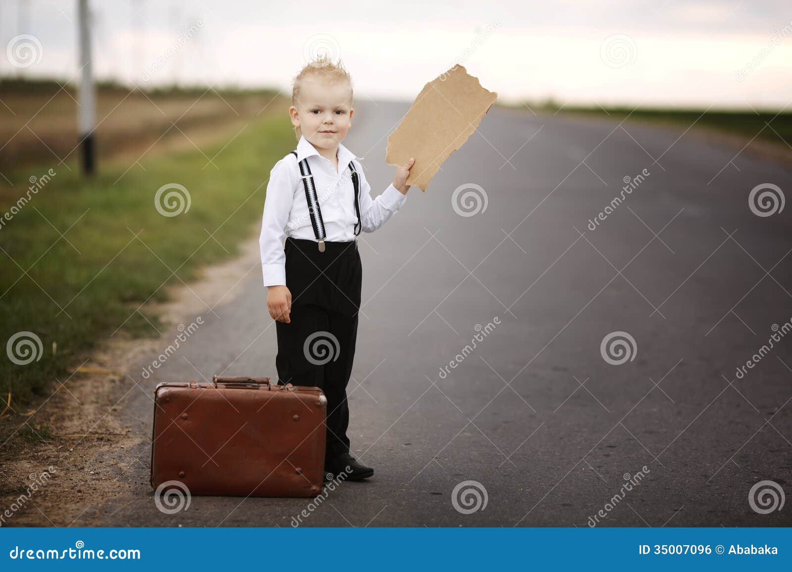 Boy hitch hiking at road stock photo. Image of little - 35007096