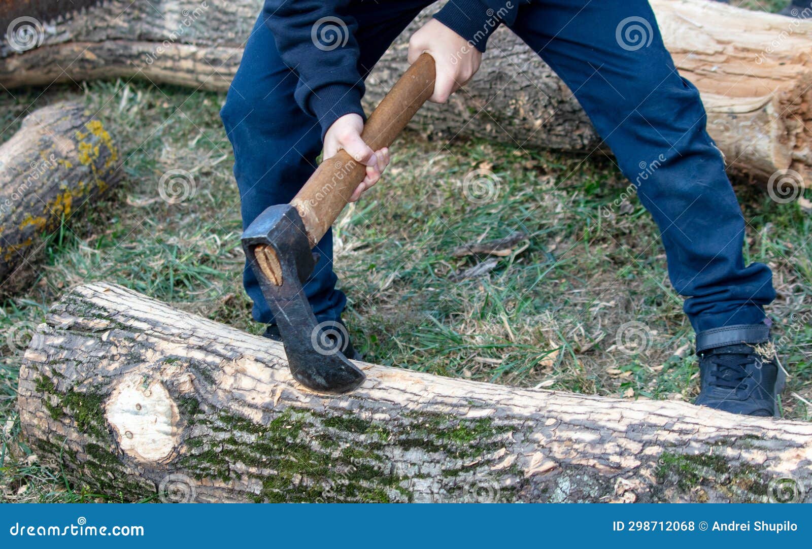 A Boy Hits a Tree with an Ax Stock Photo - Image of tool, gloves: 298712068