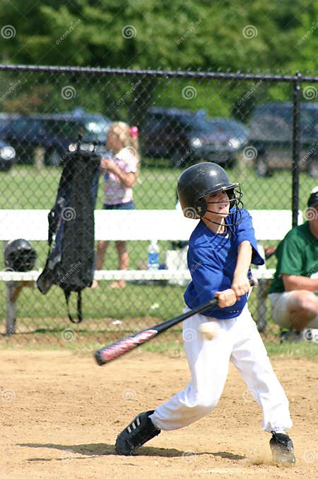 Boy Hitting Ball stock image. Image of blue, child, field - 1211425