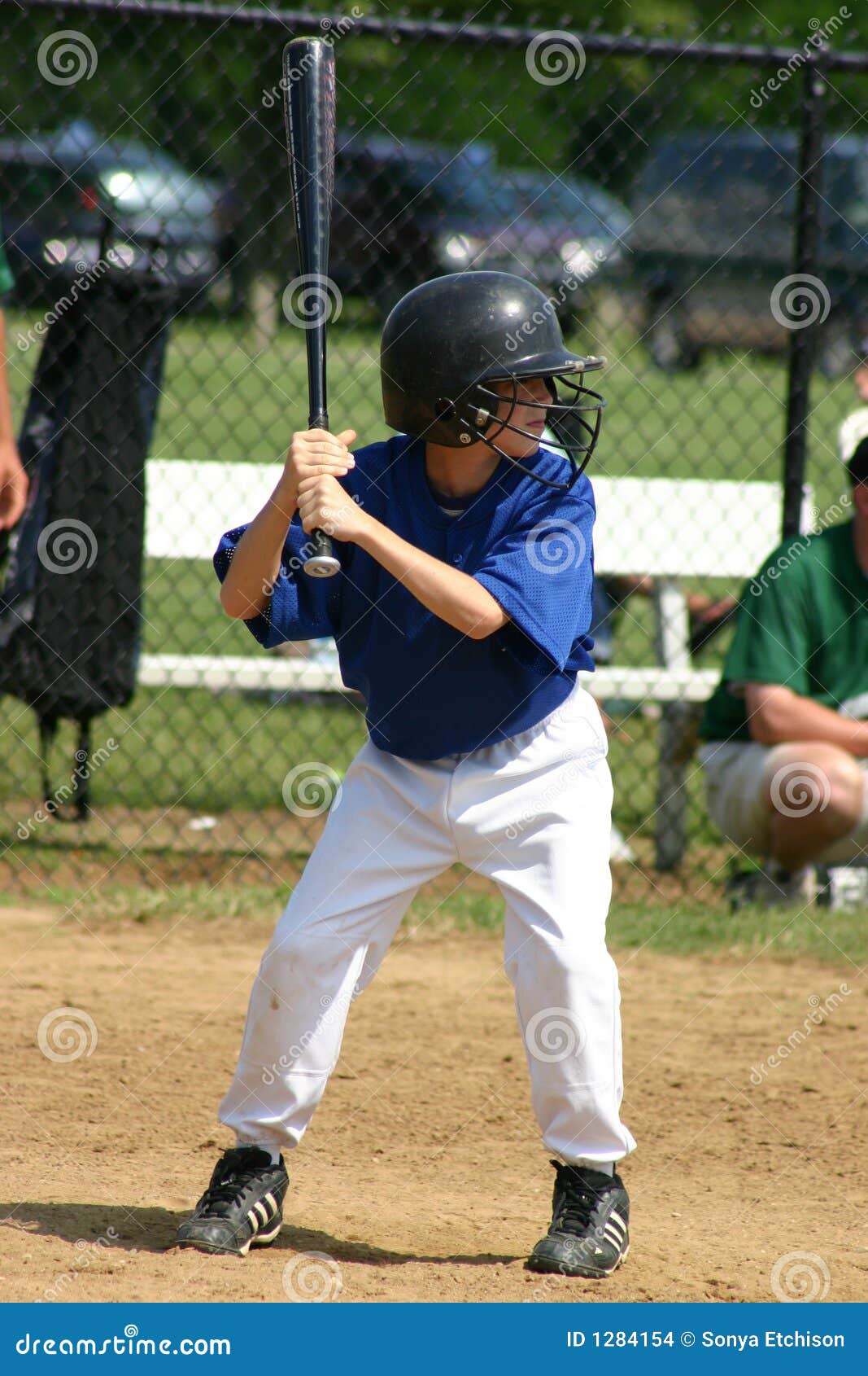 Boy Hitting Ball stock photo. Image of sibling, adolescence - 1284154